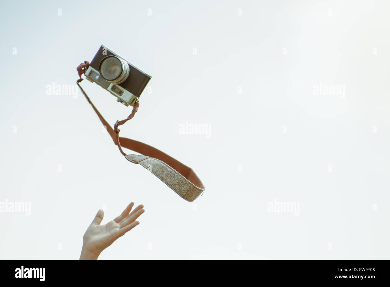 An old camera that floats on the air in stripe vintage.Old camera ...