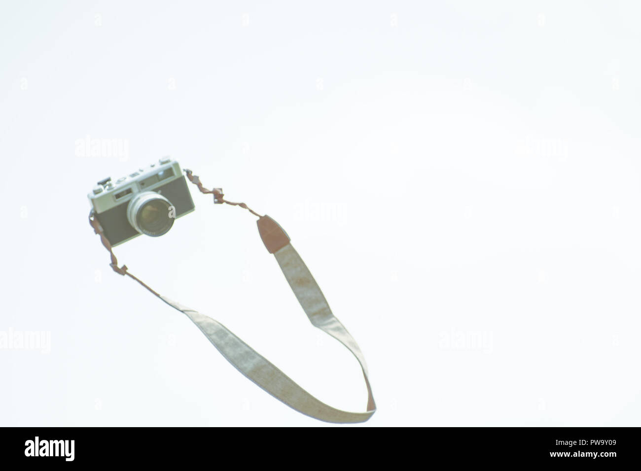 An old camera that floats on the air in stripe vintage.Old camera ...