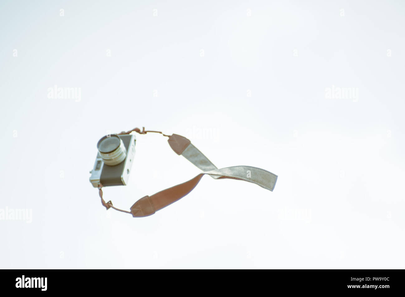 An old camera that floats on the air in stripe vintage.Old camera ...