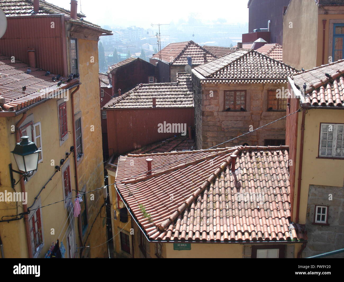 View over red tiled rooftops of the old town area of Porto, Portugal ...
