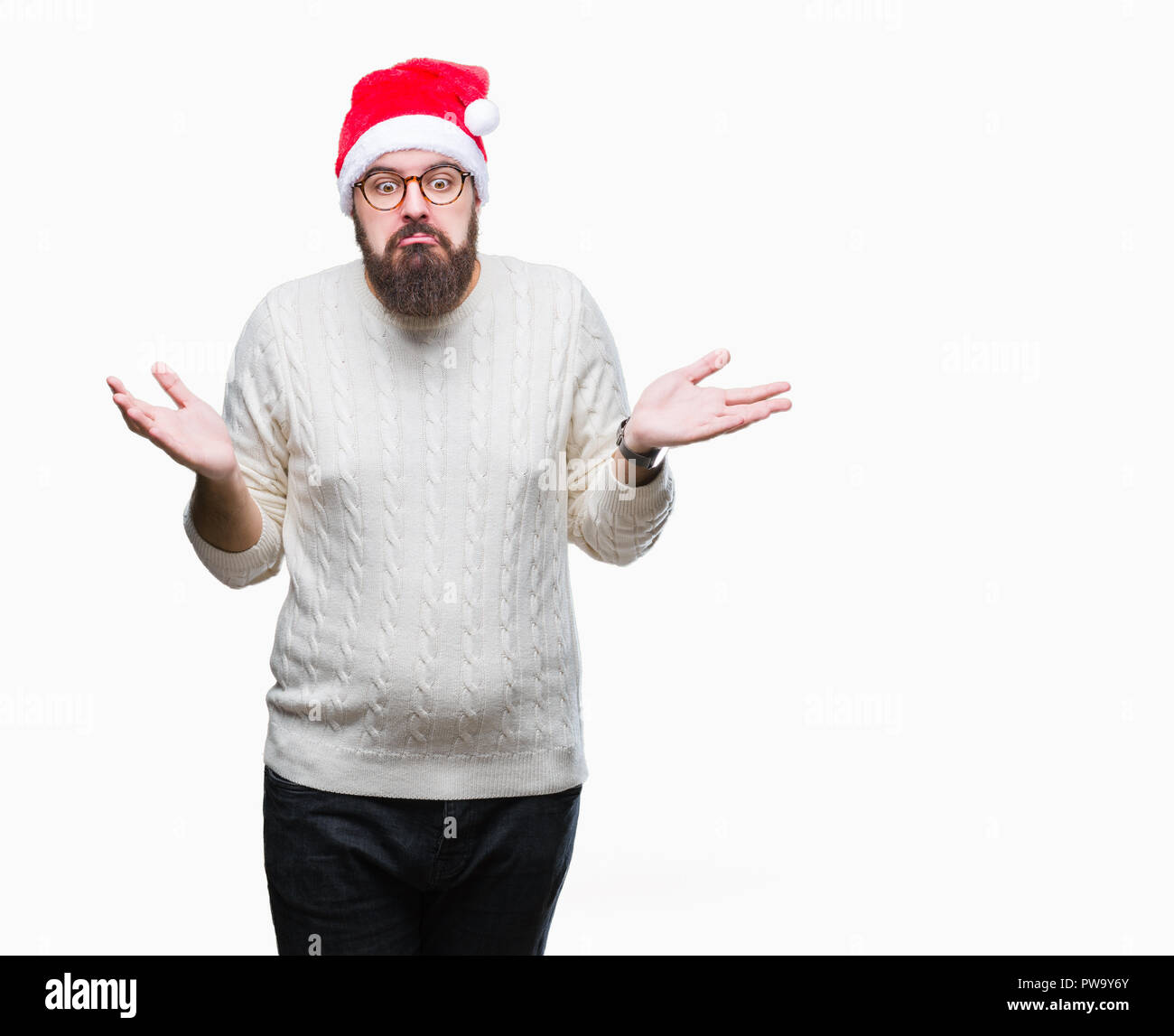 Young caucasian man wearing christmas hat and glasses over isolated ...