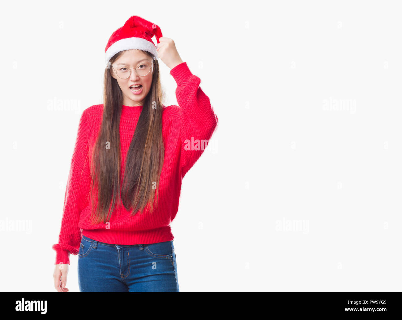 Young Chinese woman over isolated background wearing christmas hat ...