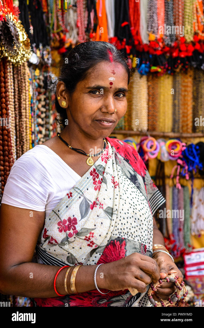 VARANASI, INDIA - AUG 16, 2014: Indian woman selling jewelry Stock ...