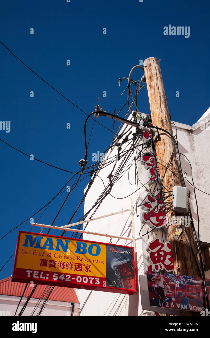 Tangled electrical cables on a telegraph pole on Saint Martin in the ...