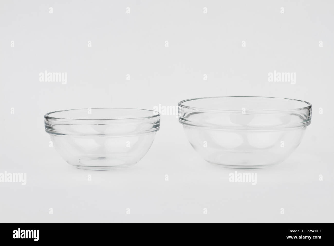 Two transparent glass bowls. Empty glass bowls for fruits and salads ...