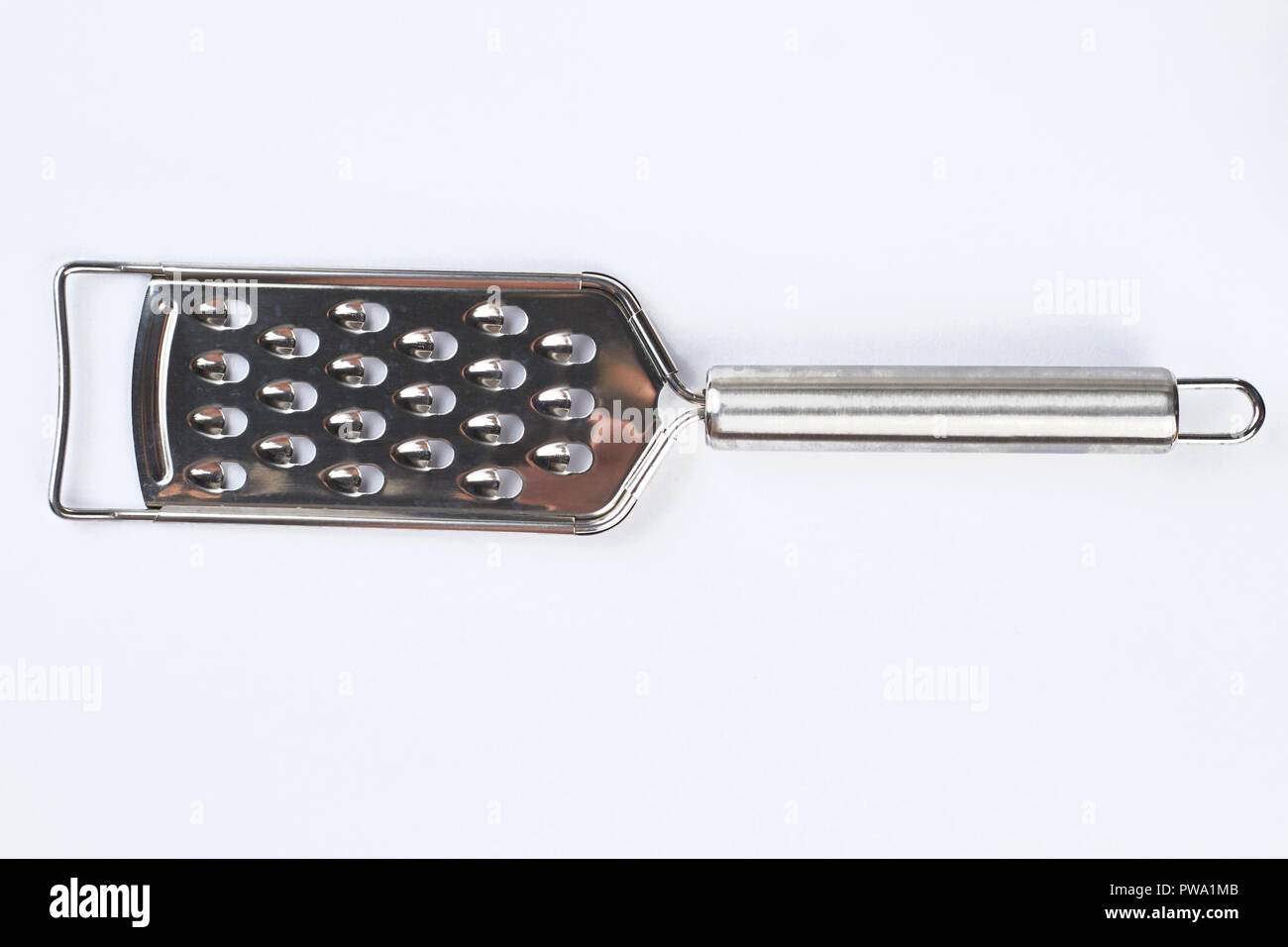 Cheese grater isolated on light background. Stainless steel grater ...