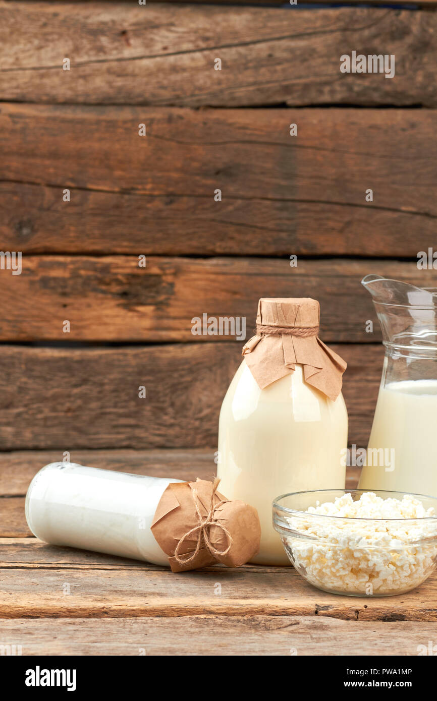 Eco milk products on wooden background. Healthy dairy ingredients ...