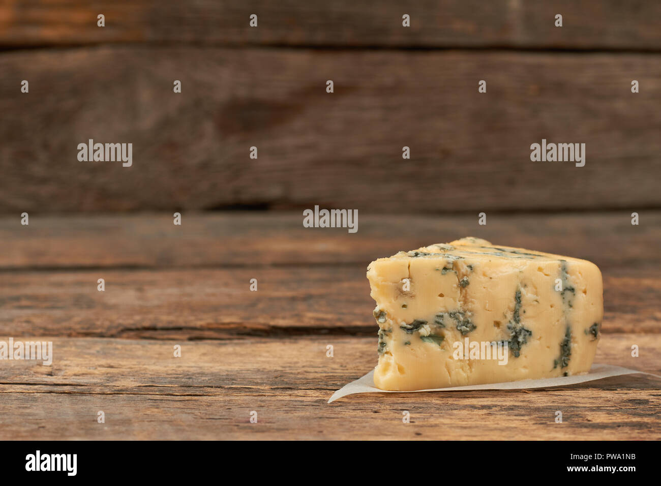 Blue cheese Gorgonzola on a rustic wooden background. French musty ...