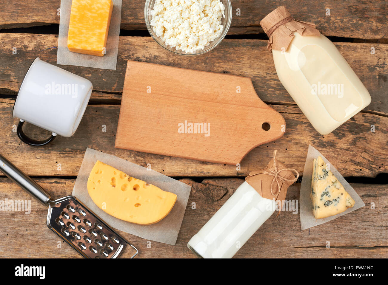 Set of dairy products on wooden background. Assorted milk products on ...