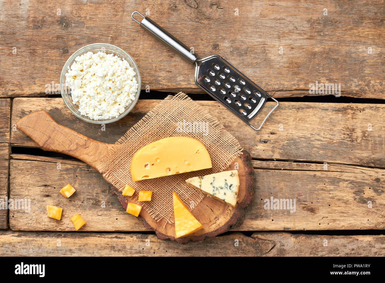Fresh dairy products, top view. Cheese platter on rustic wood and copy ...