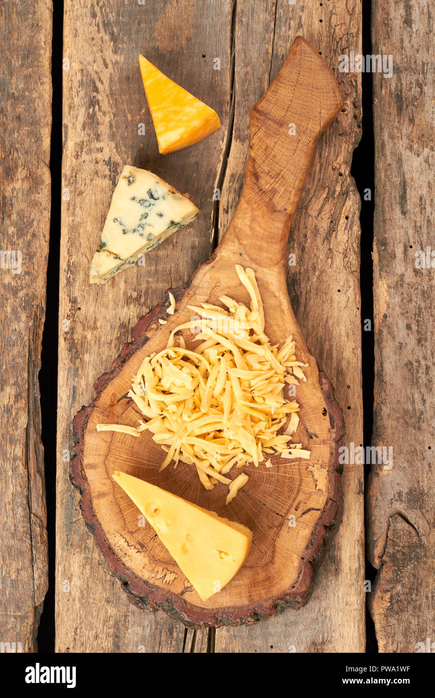 Cheese on rustic wood, top view. Mix of delicious cheese on rustic ...