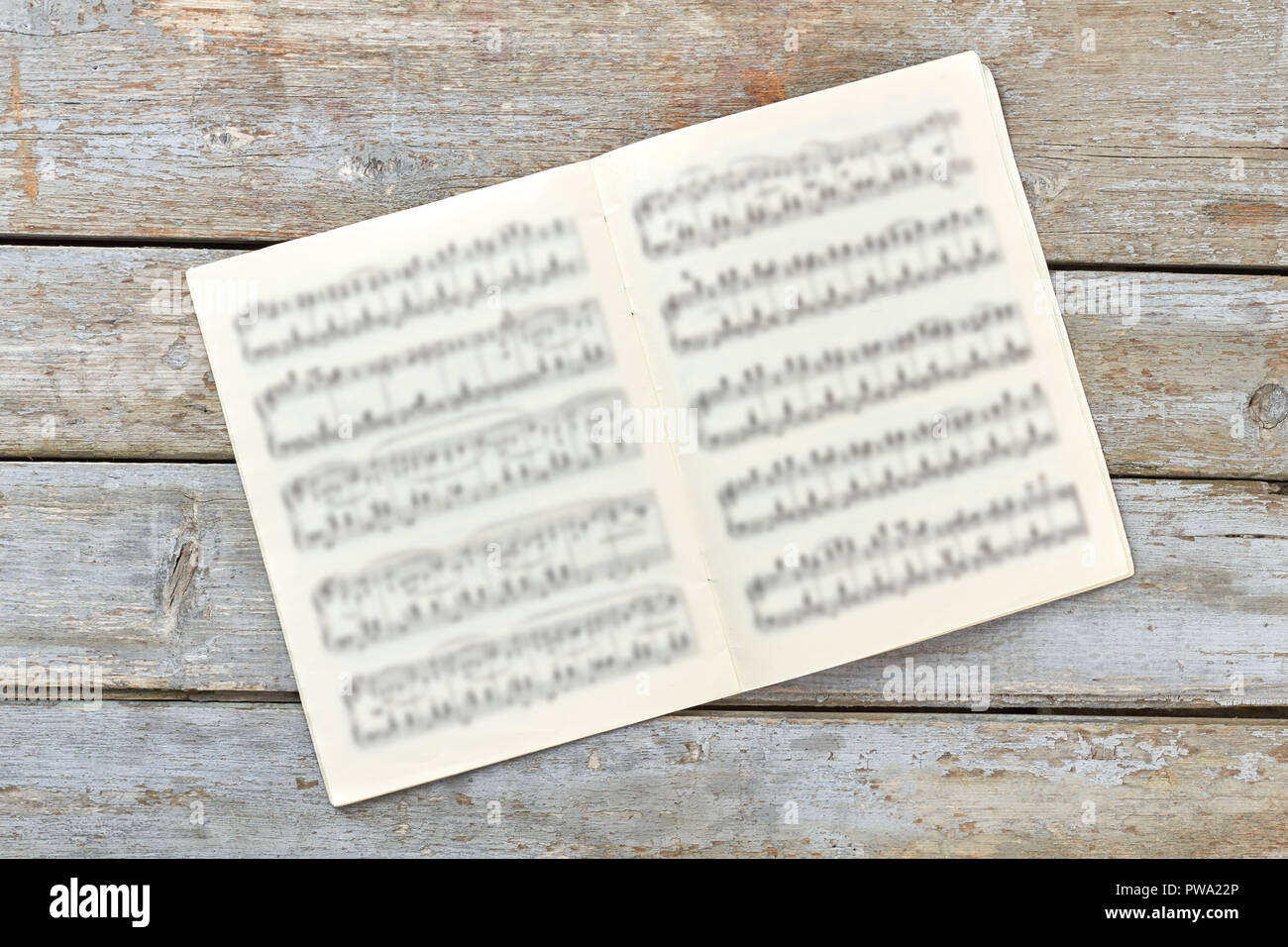 Musical notes book on rustic background. Musical papers on vintage ...