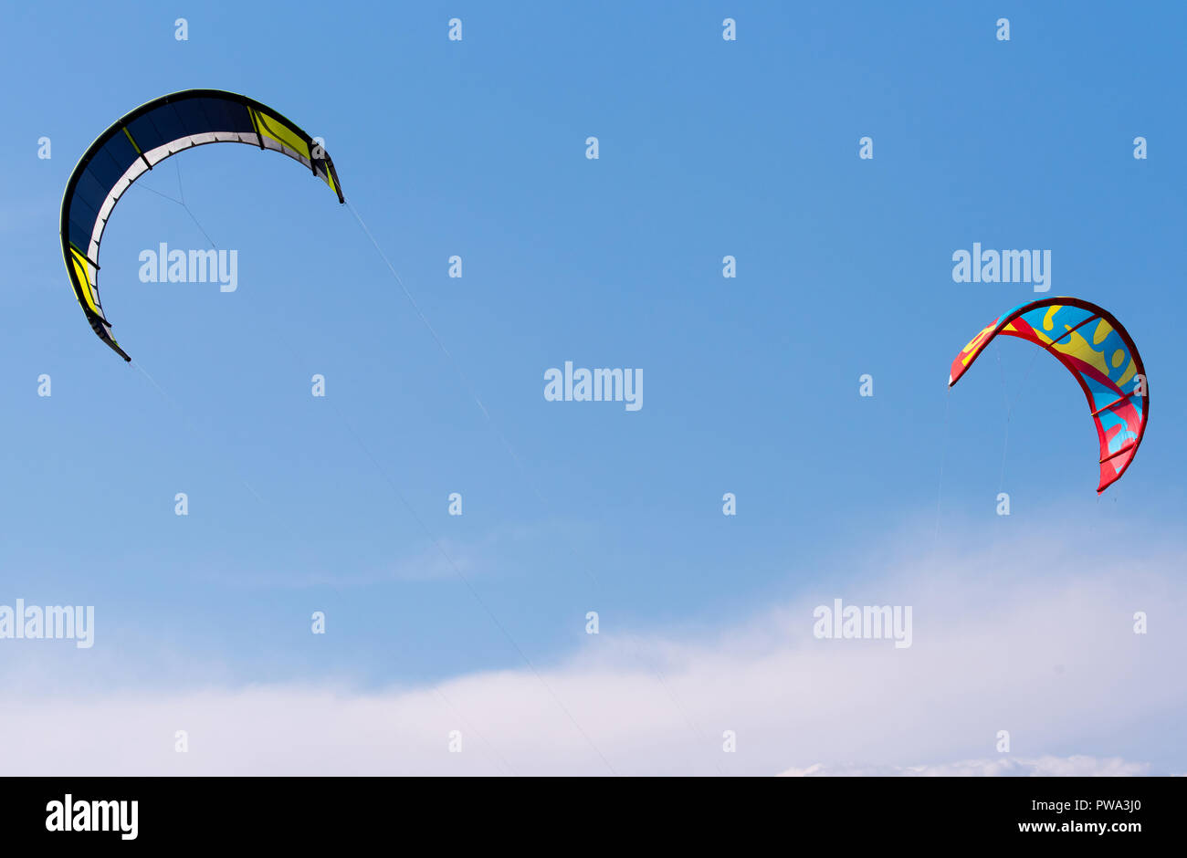 Kites flying in the sky. Kiteboarding kites Stock Photo - Alamy