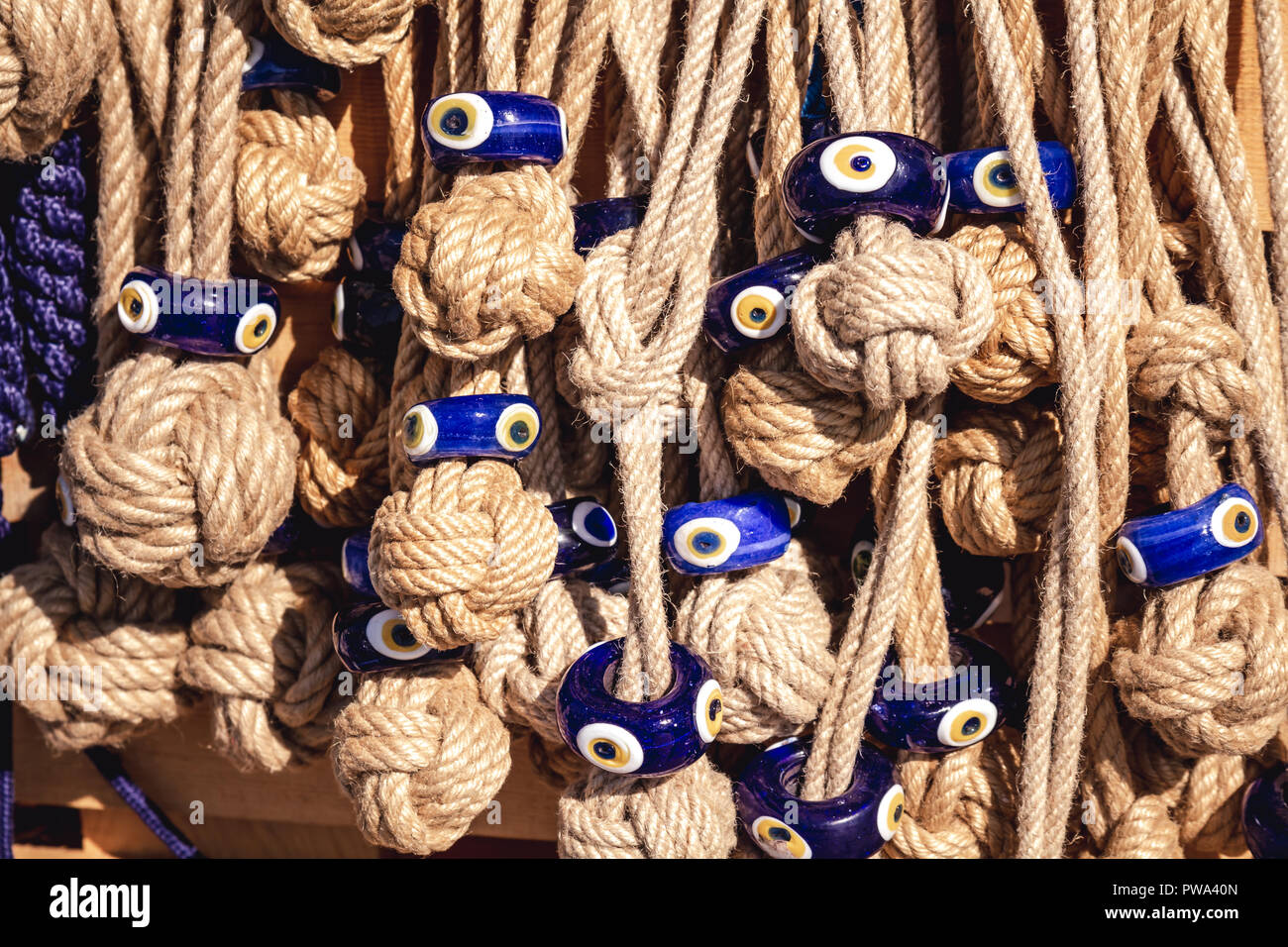 Rope knitted evil eyes for wall and door decoration Stock Photo - Alamy