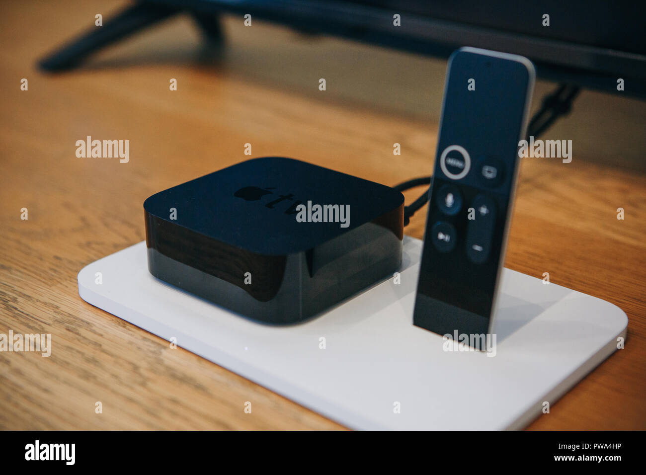 Berlin, August 29, 2018: Apple TV device and remote control or joystick ...