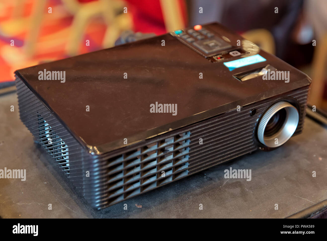 mini led projector on wood table in a room projector home theater idea ...