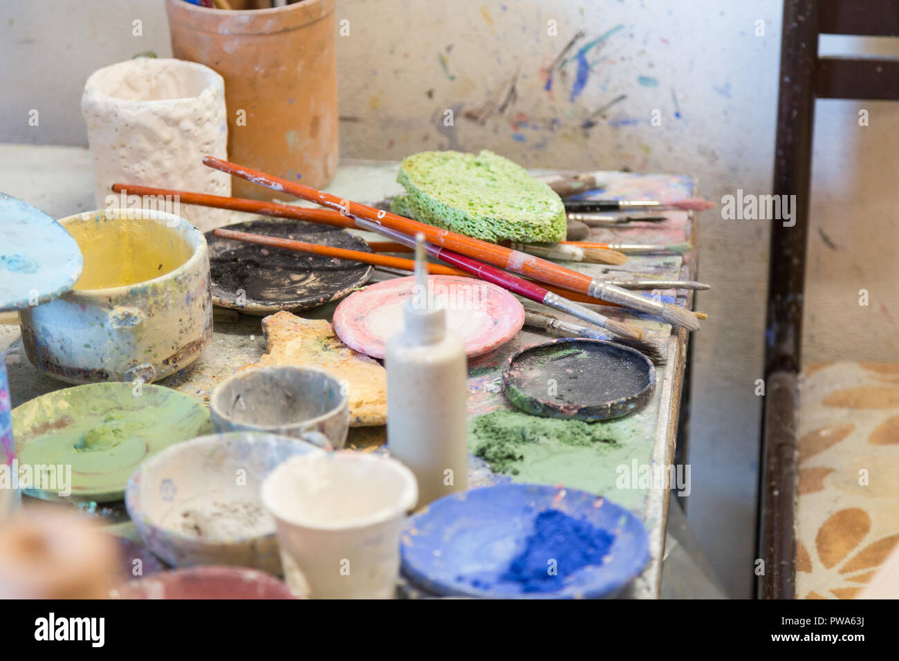 Coloring and painting utensils on a desk Stock Photo - Alamy