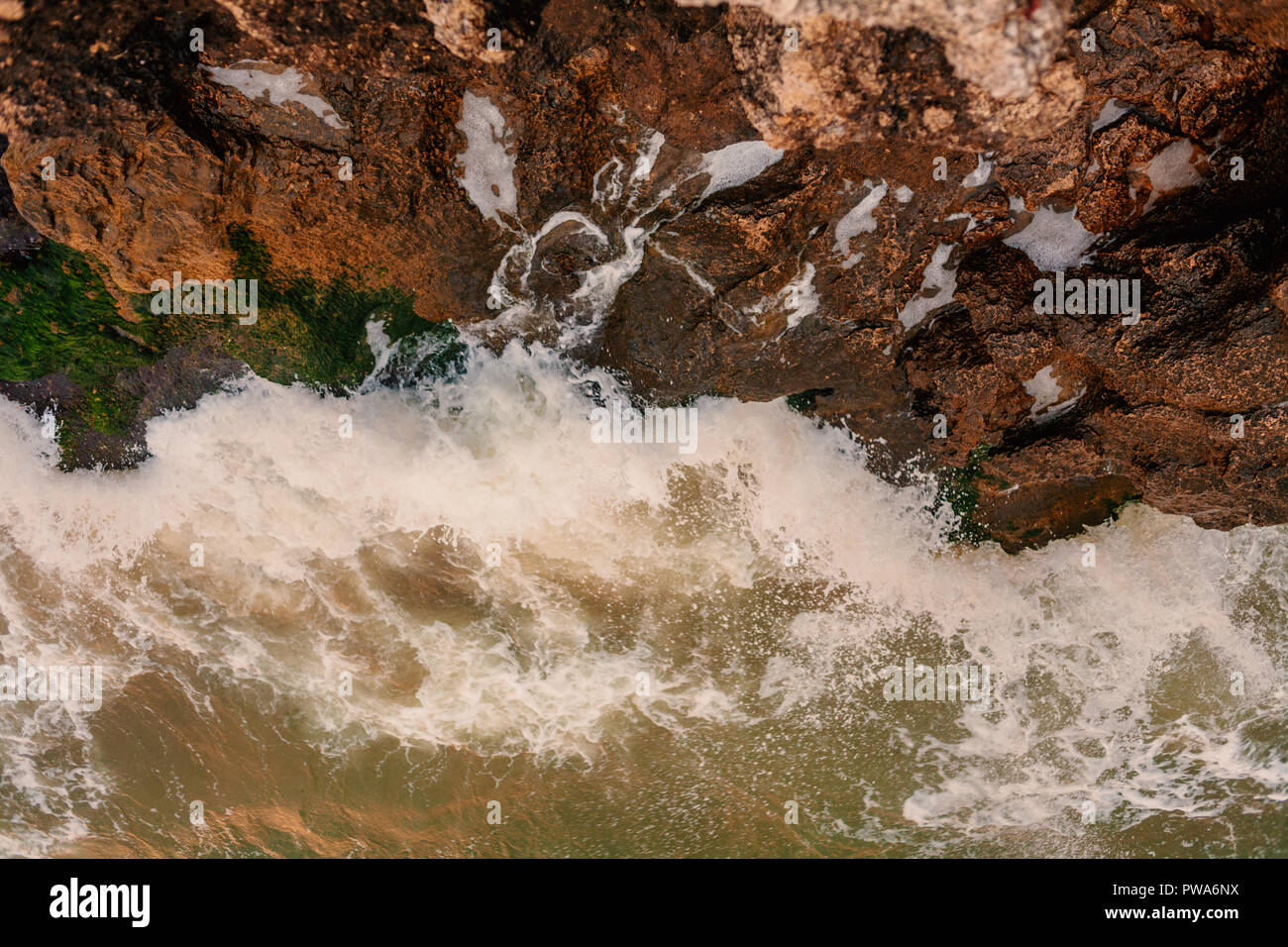 Aerial view of the disturbed sea and the rock. Aerial view of the ...