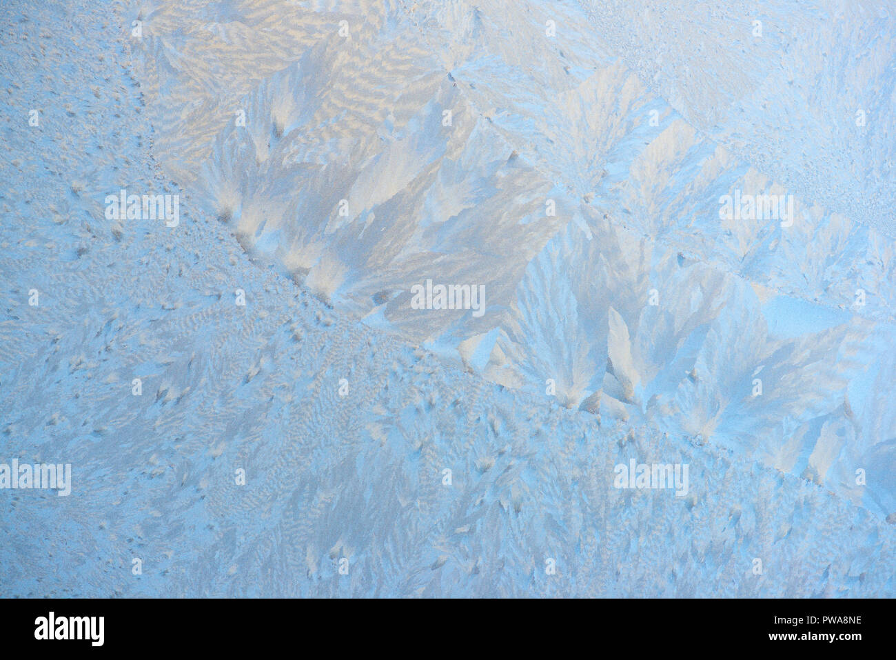 beautiful frost patterns background of ice on window, close up Stock ...