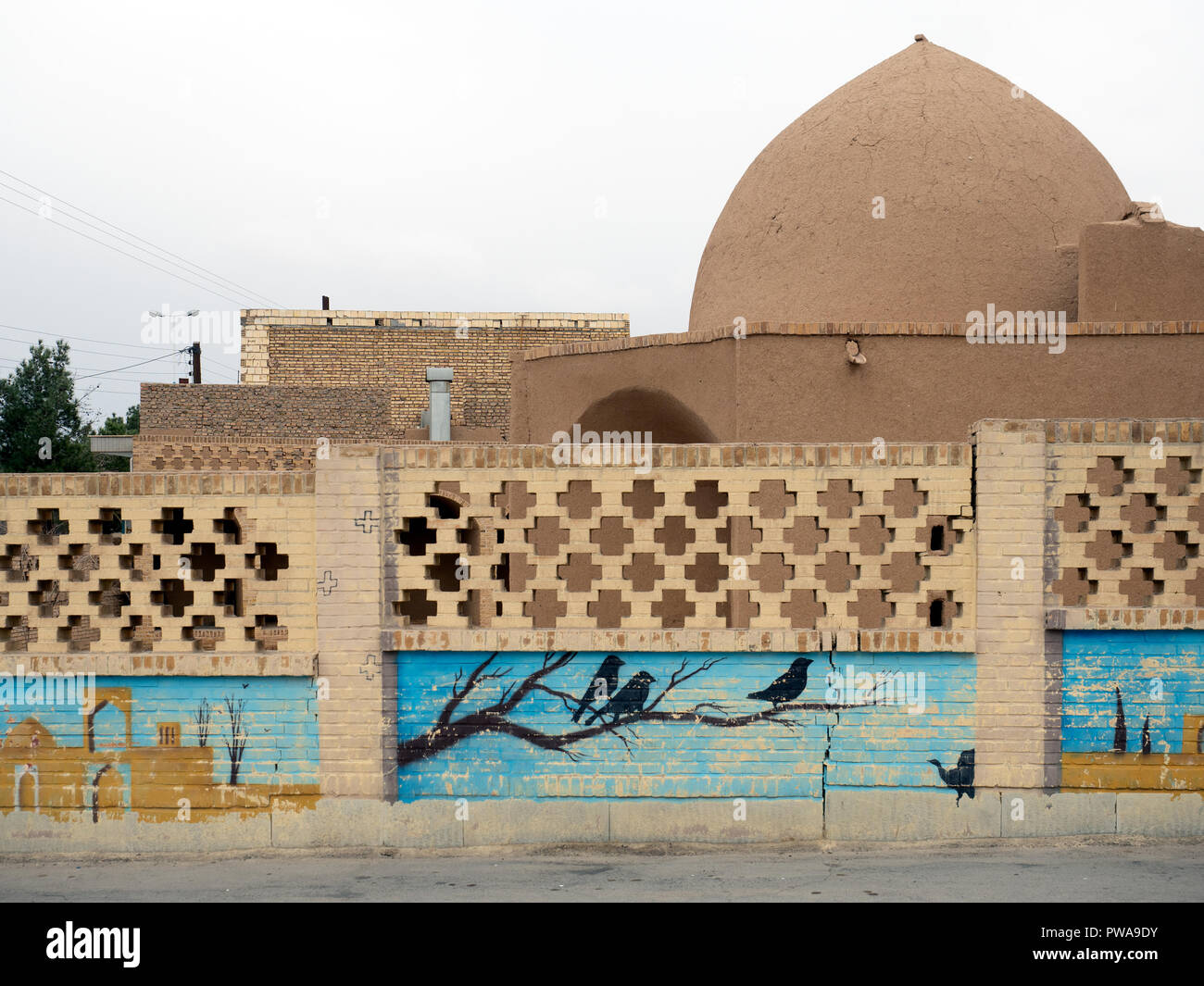 Historic adobe building surrounded by a painted wall, Meybod, Iran ...
