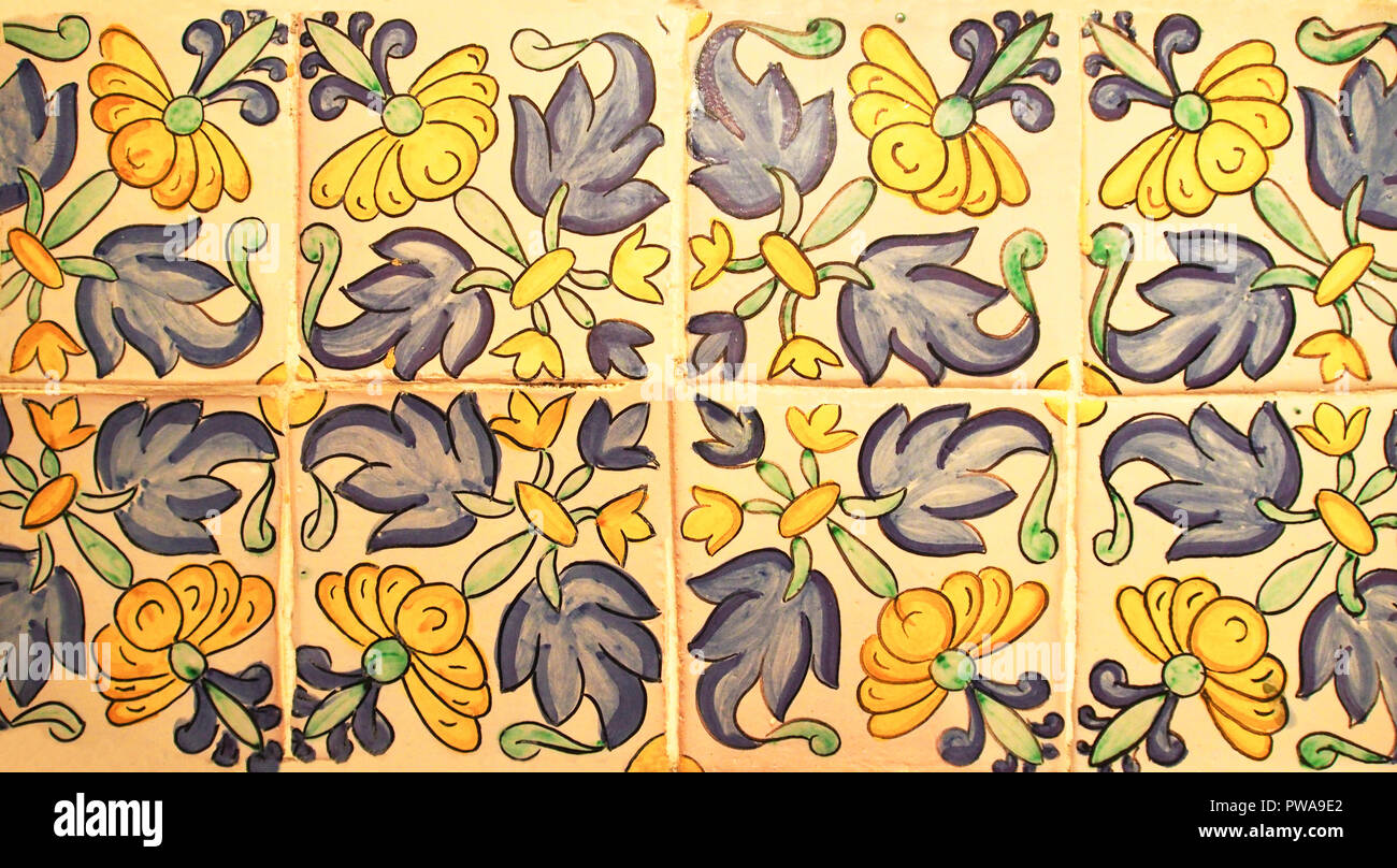 Detail of the traditional tiles from facade of old house. Decorative ...