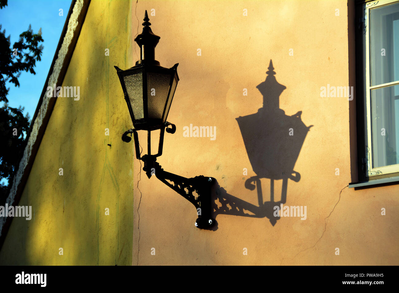 A beautiful lantern casting a shadow in Tallinn, Estonia Stock Photo ...