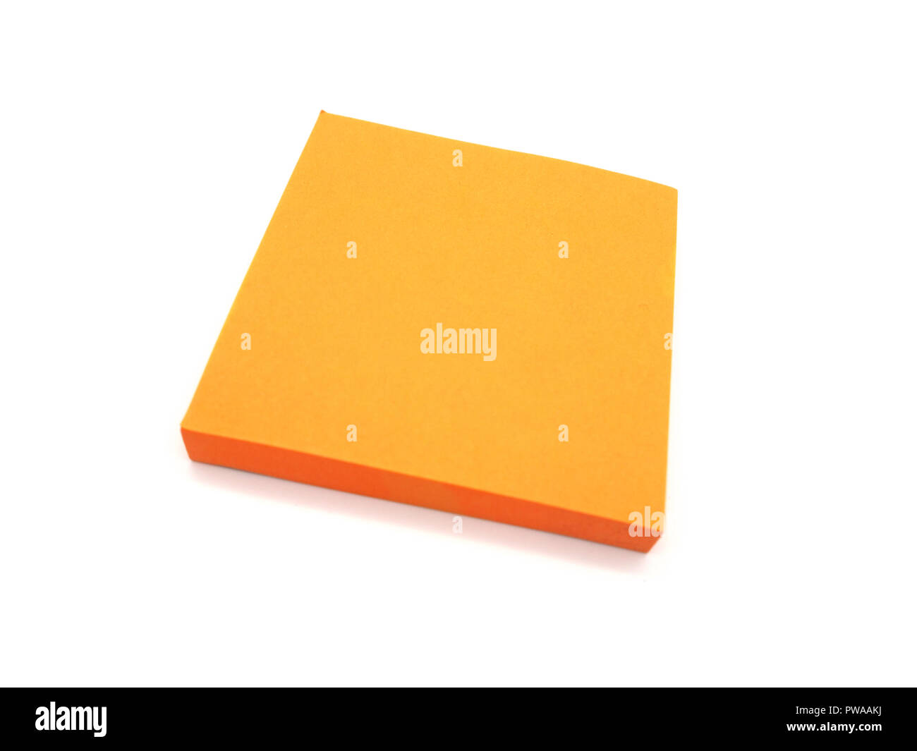 Orange paper stick note on a white background Stock Photo - Alamy