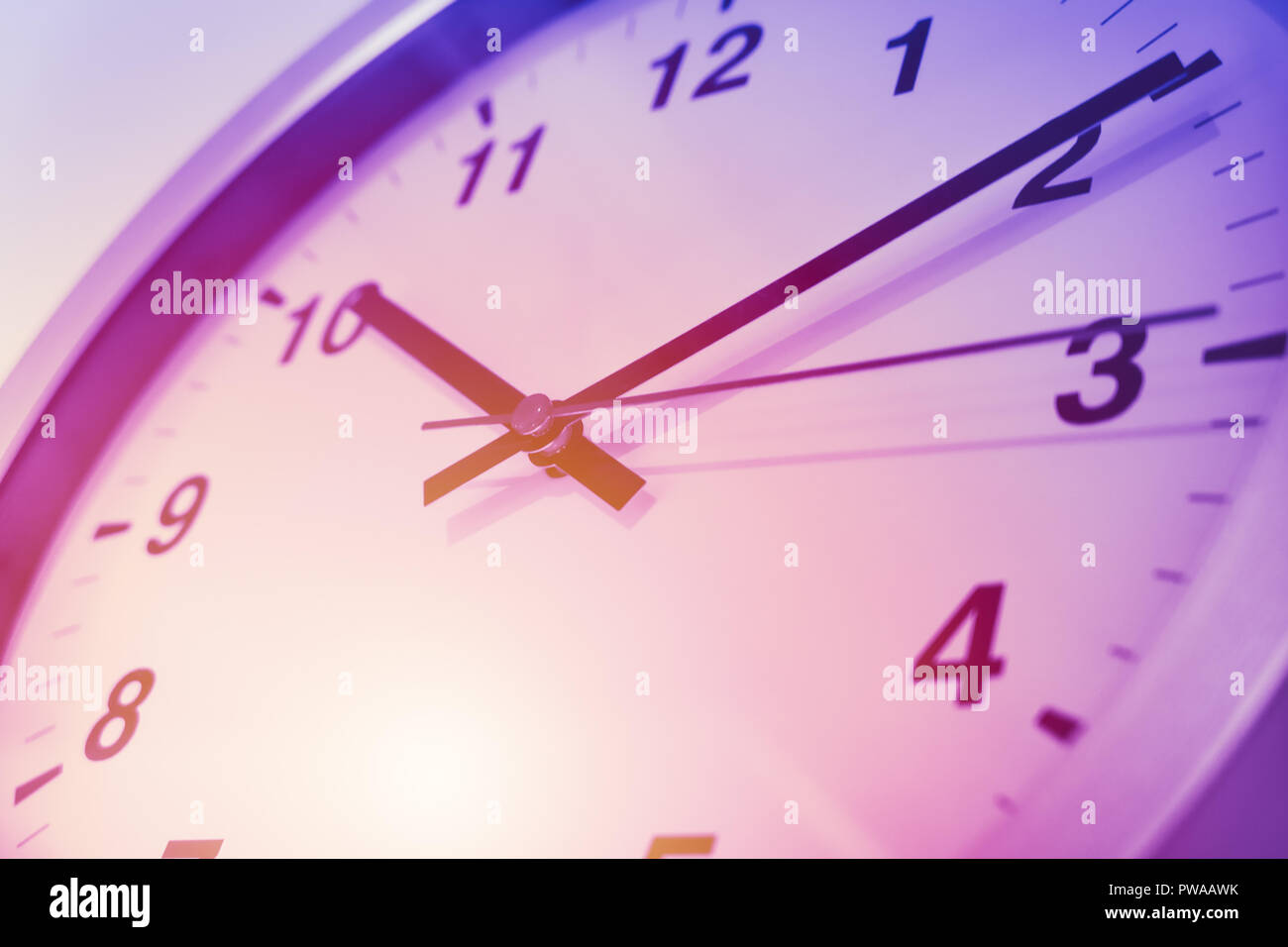 violet purple times clock face closeup Stock Photo - Alamy