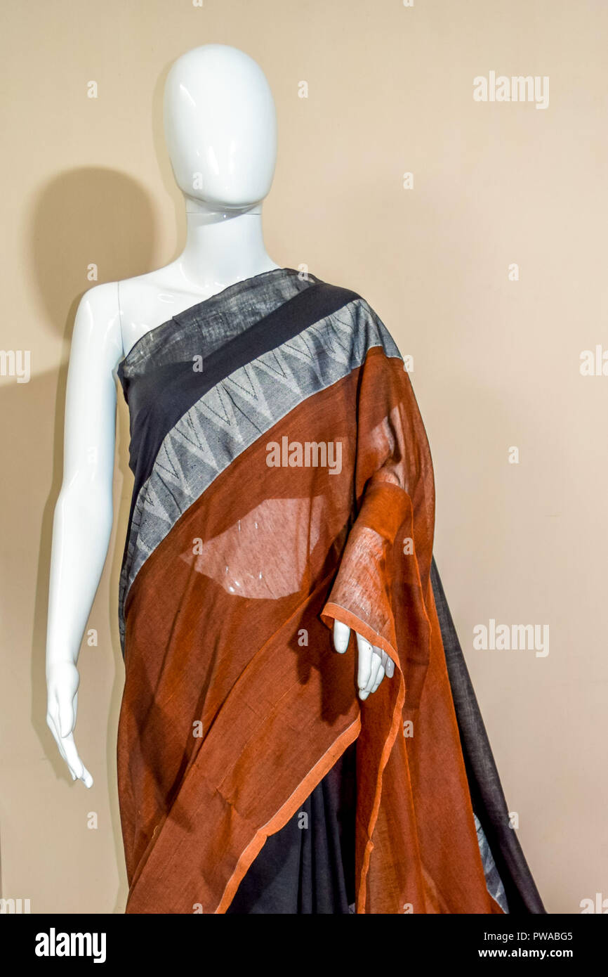 A traditional indian colorful silk saree displayed for sale. Selective ...