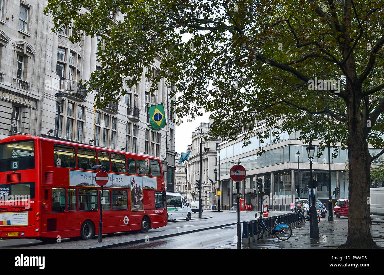 London street red bus on building flag of Brazil Stock Photo - Alamy