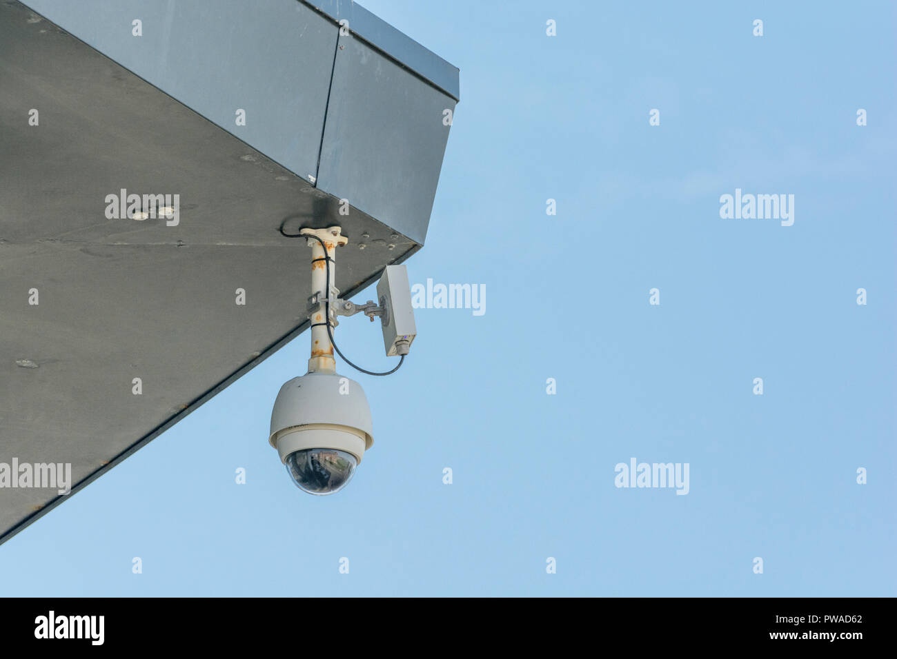 CCTV surveillance camera 'Watching Over You'. Crime prevention metaphor ...