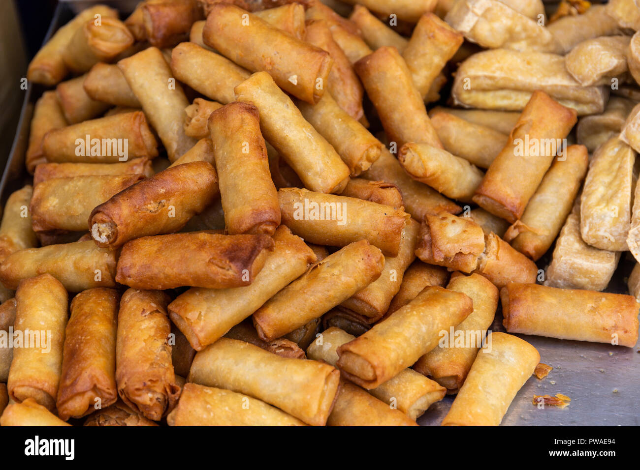 Deep fried Chinese spring rolls. Street food in Bangkok's China town ...