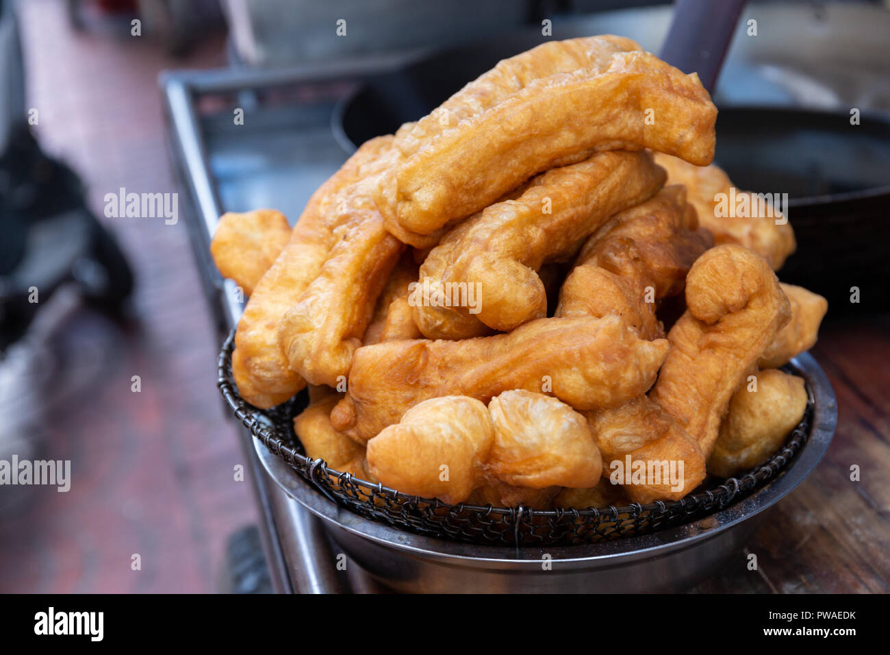 Youtiao or Chinese breadstrick also known as Chinese fried dough or ...