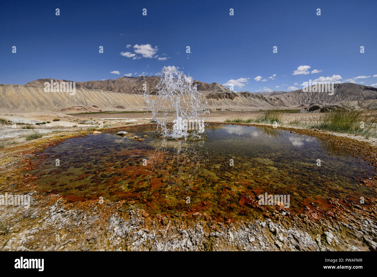 Geyser spouting near Lake Bulunkul, Tajikistan Stock Photo - Alamy