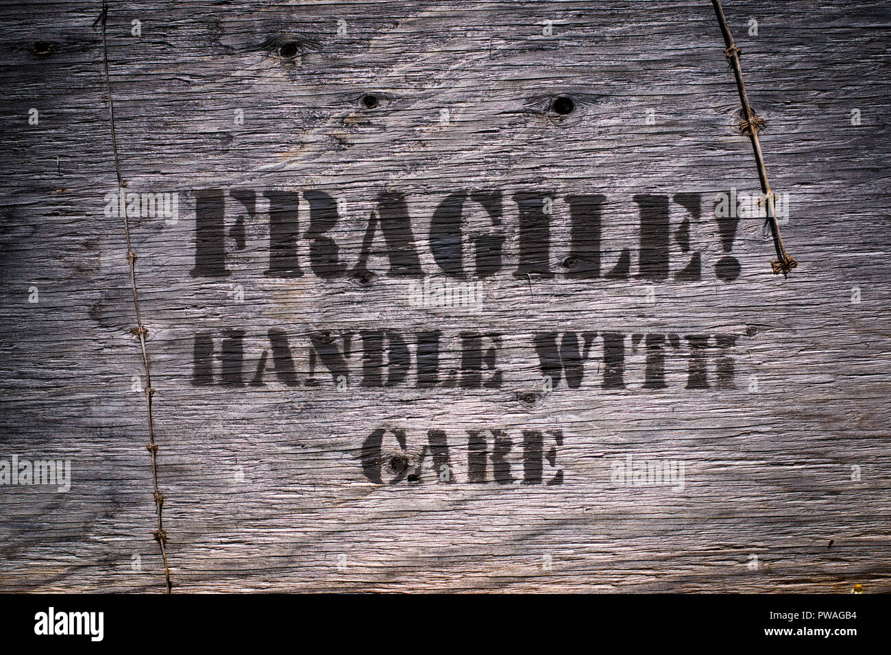 wood board with warning label stencil Stock Photo - Alamy