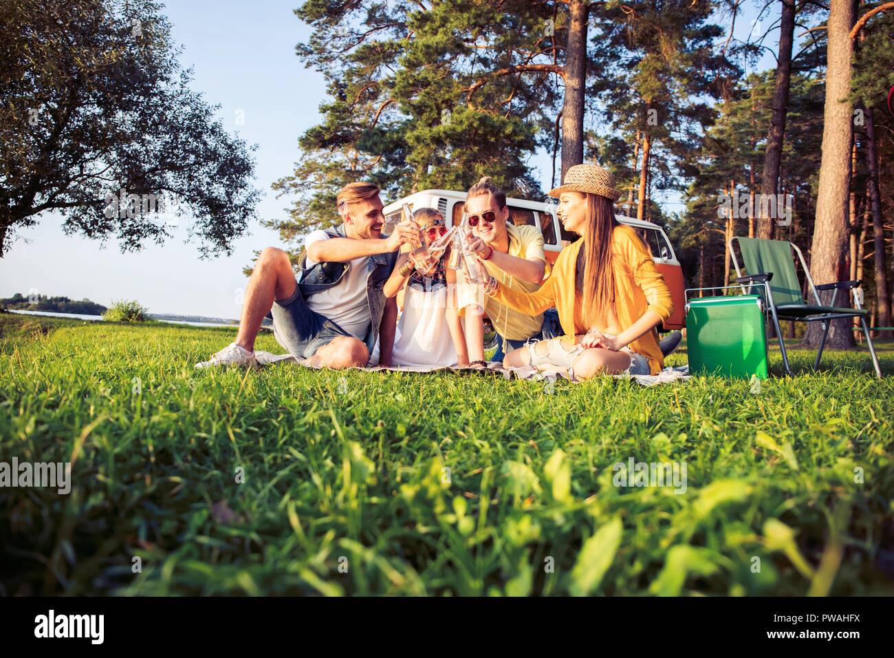 Hipster friends by camper van at festival on a summers day Stock Photo ...