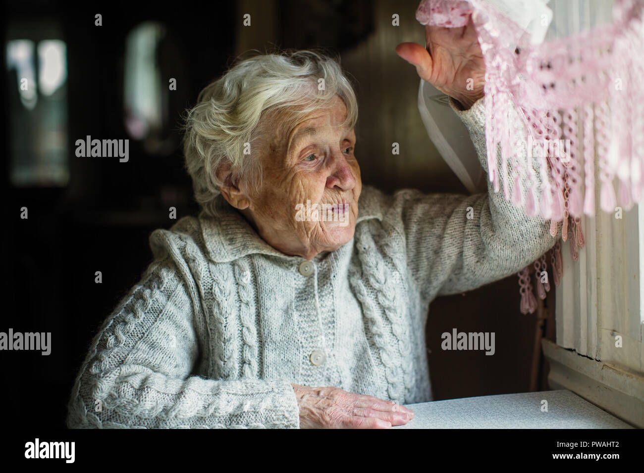 Grandma Looking Out Window High Resolution Stock Photography and Images ...