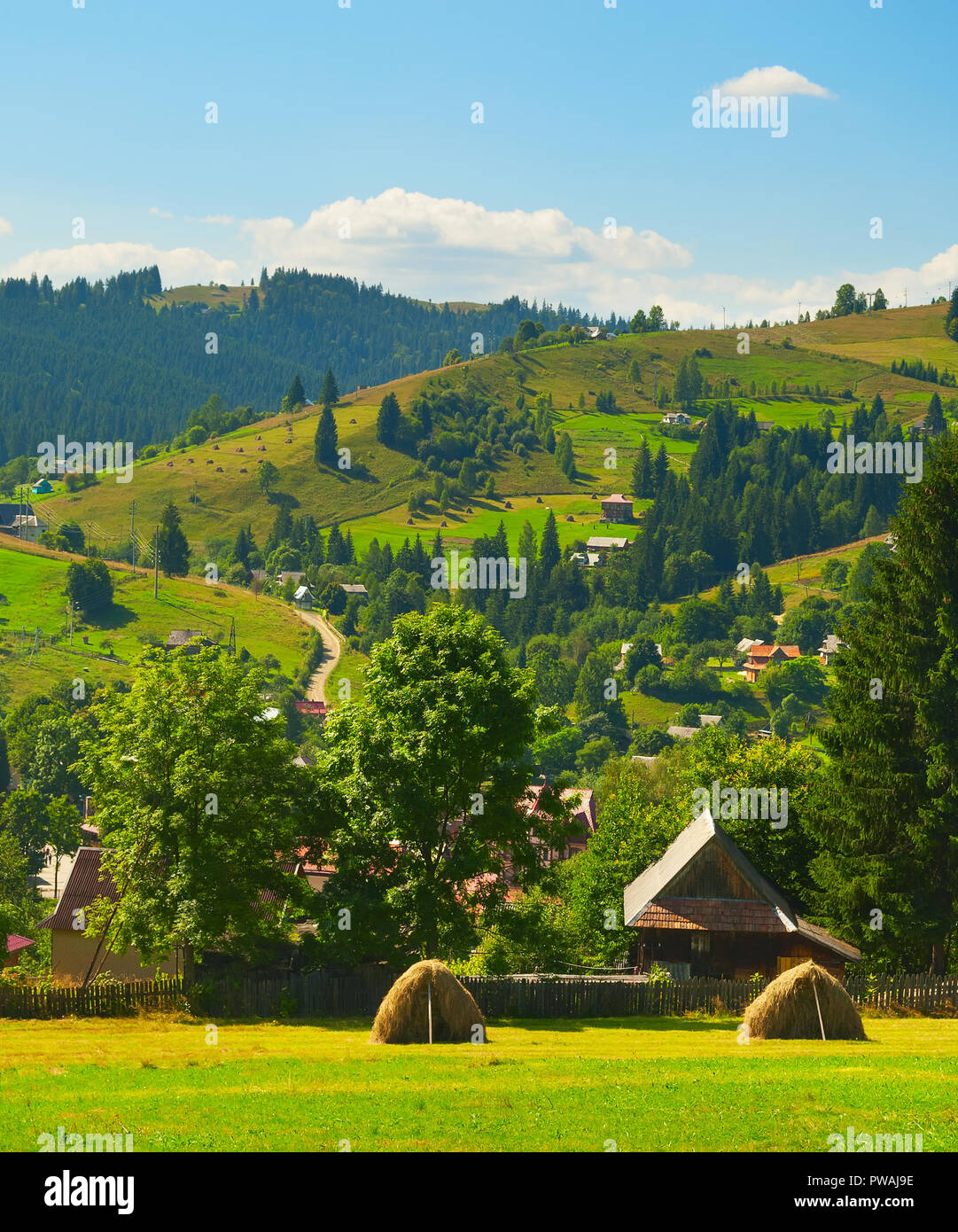 View of Carpathians mountains village in the hot summer day. Ukraine ...