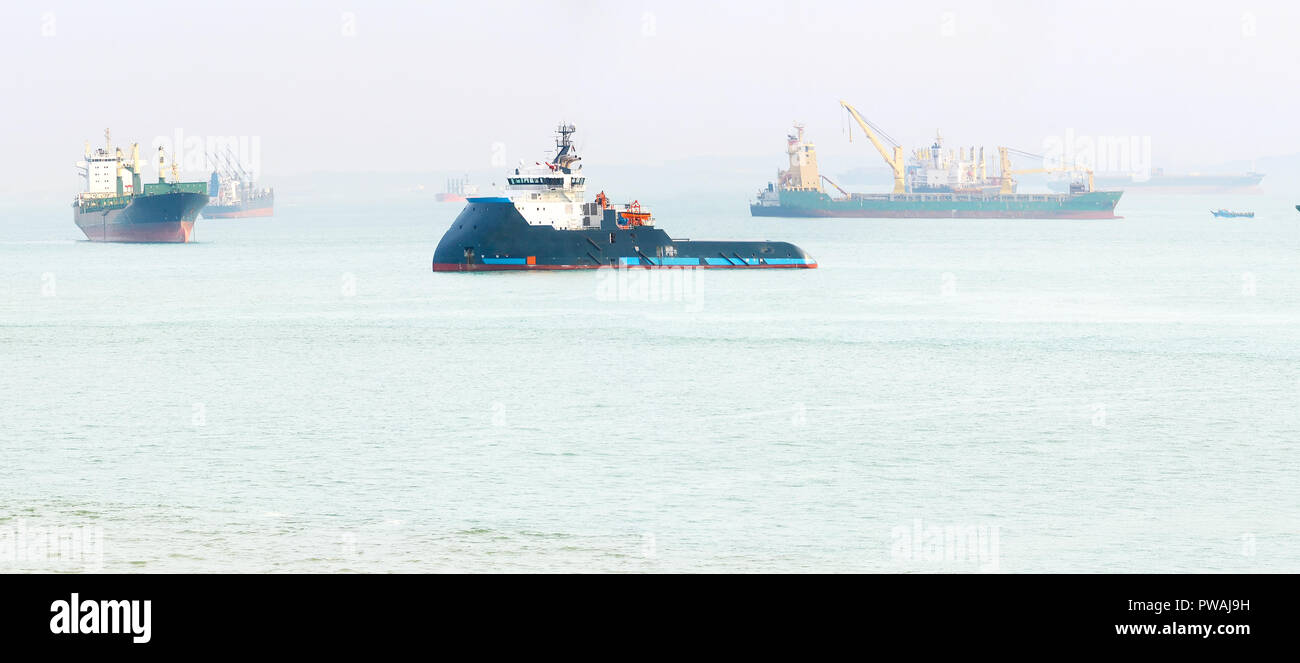 Industrial cargo ships in Singapore harbor Stock Photo - Alamy