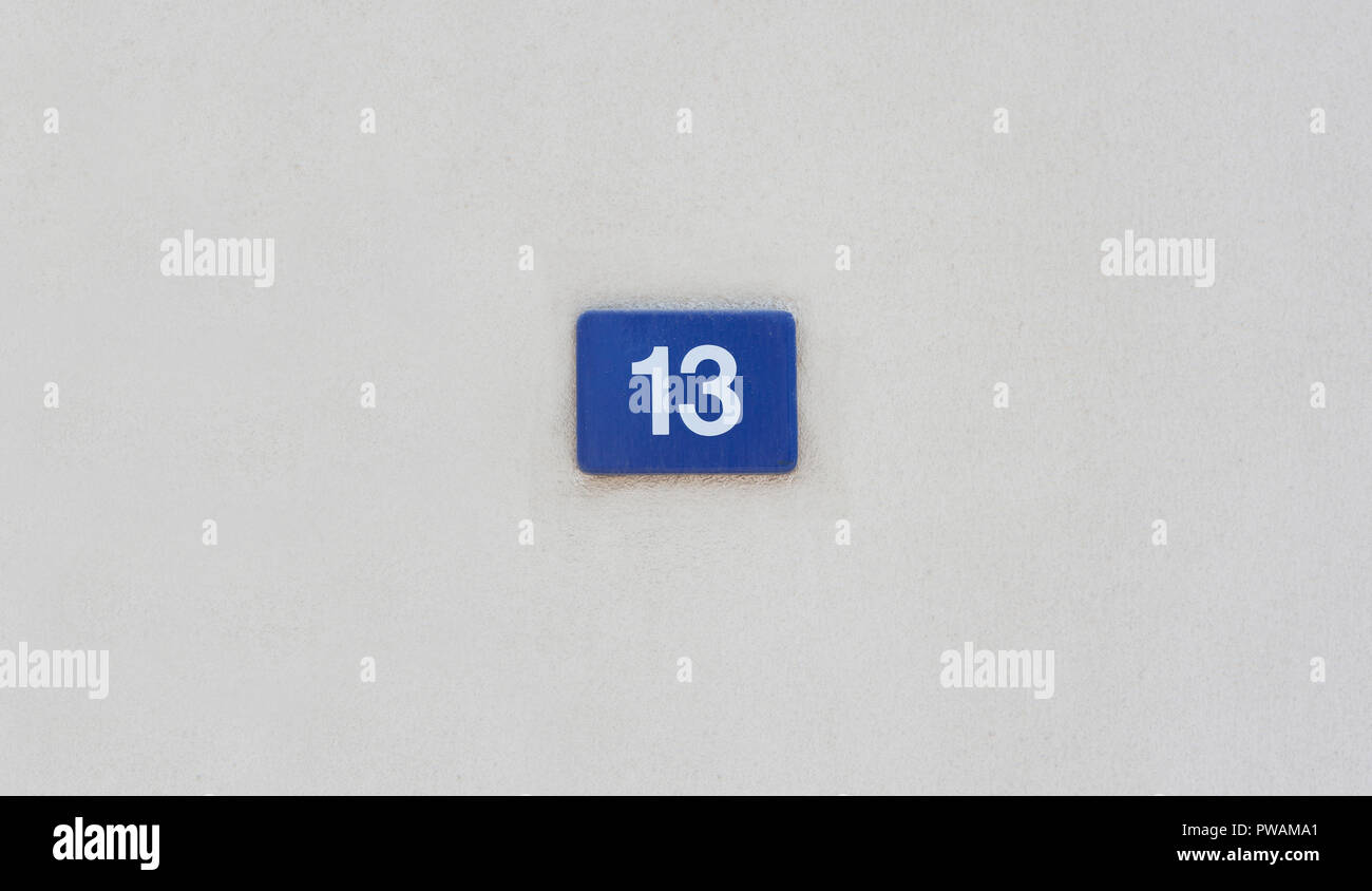 number 13 sign on the wall, bad luck concept Stock Photo - Alamy