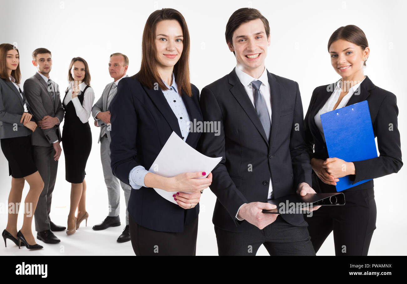 Portrait of business leaders and their team on white background Stock ...