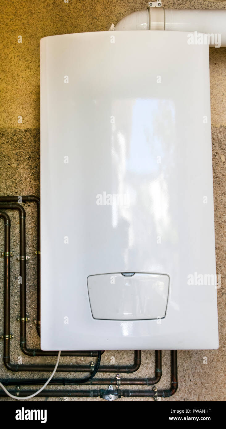 Installation of a boiler to heat the water and radiators of a home ...