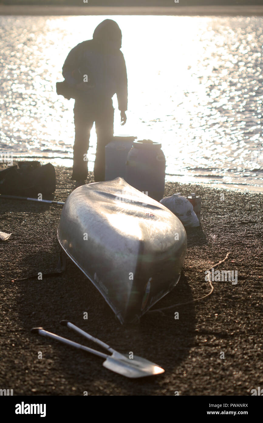 Yukon river, Yukon Territory, Alaska. Back lit image of an explorer ...