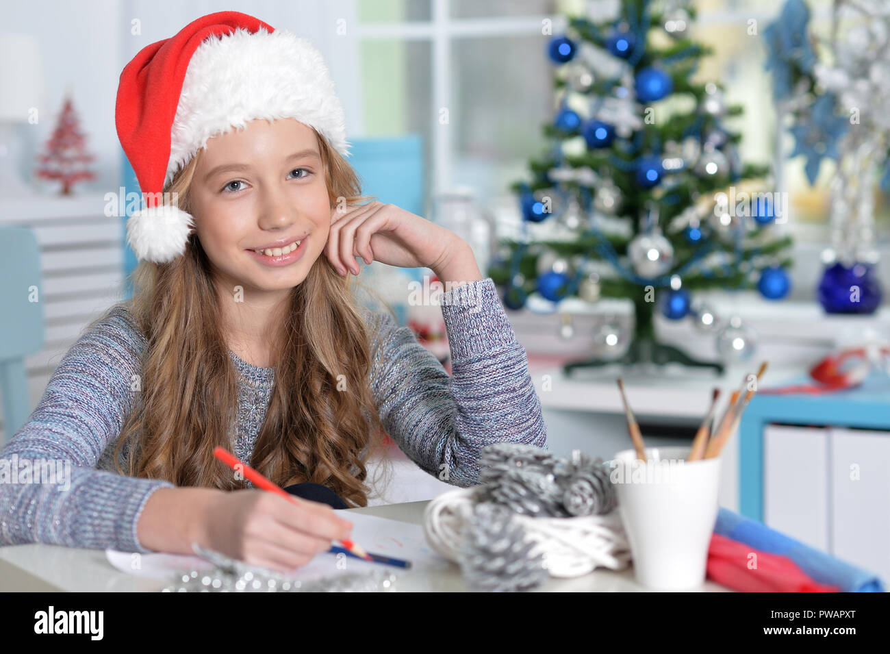 Portrait of a teen girl writing letter Stock Photo - Alamy