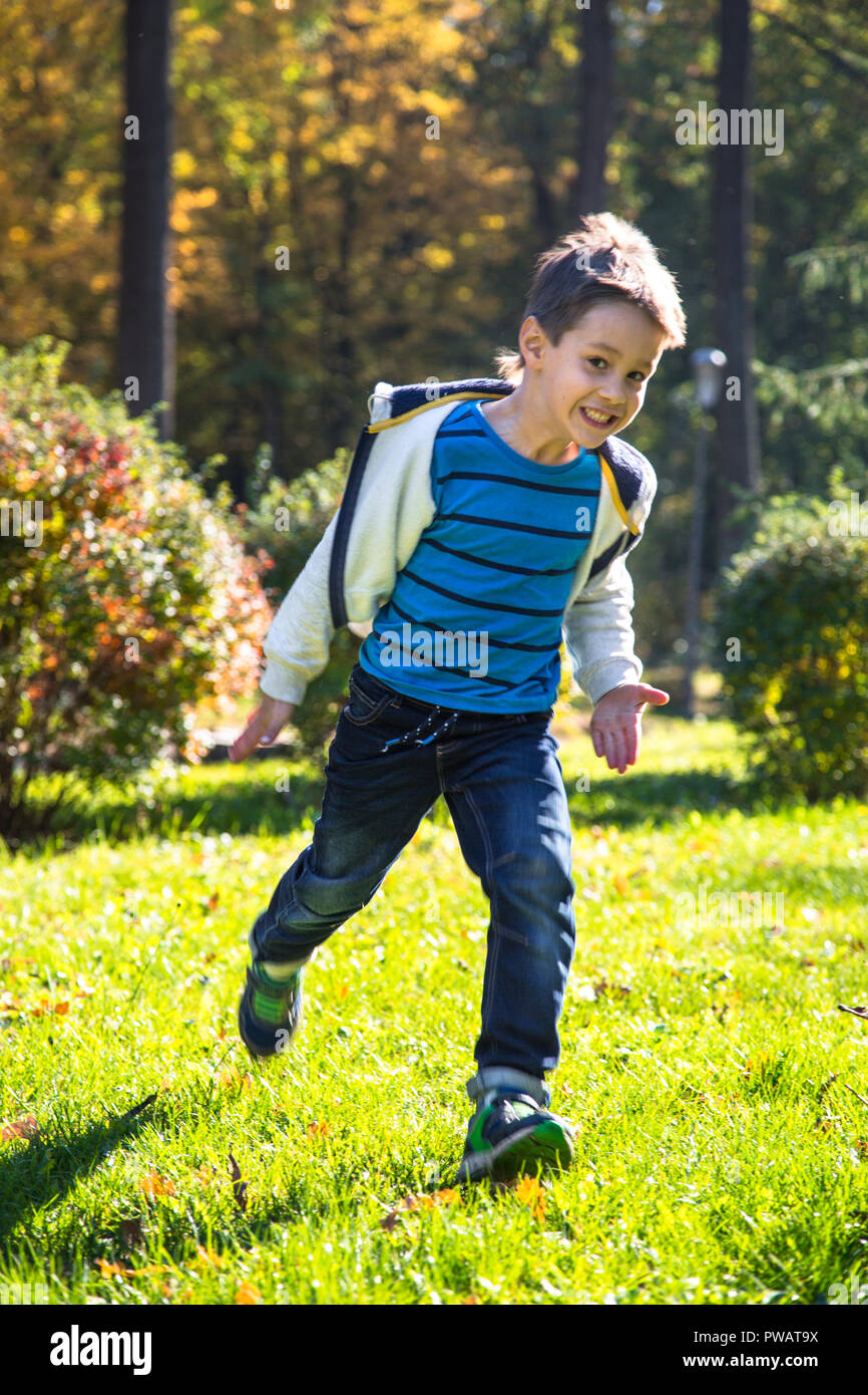 Kid run park hi-res stock photography and images - Alamy
