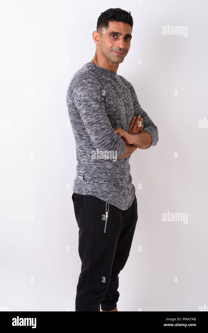 Young muscular Persian man against white background Stock Photo - Alamy