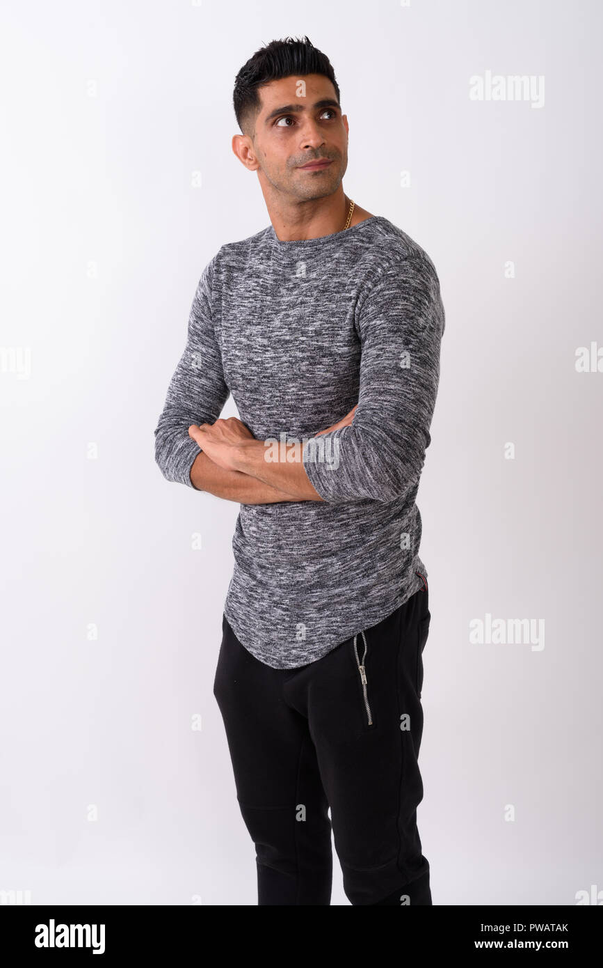 Young muscular Persian man against white background Stock Photo - Alamy
