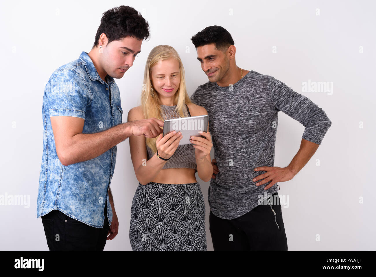 Three multi-ethnic friends together against white background Stock ...