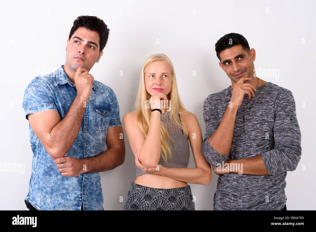 Three multi-ethnic friends together against white background Stock ...