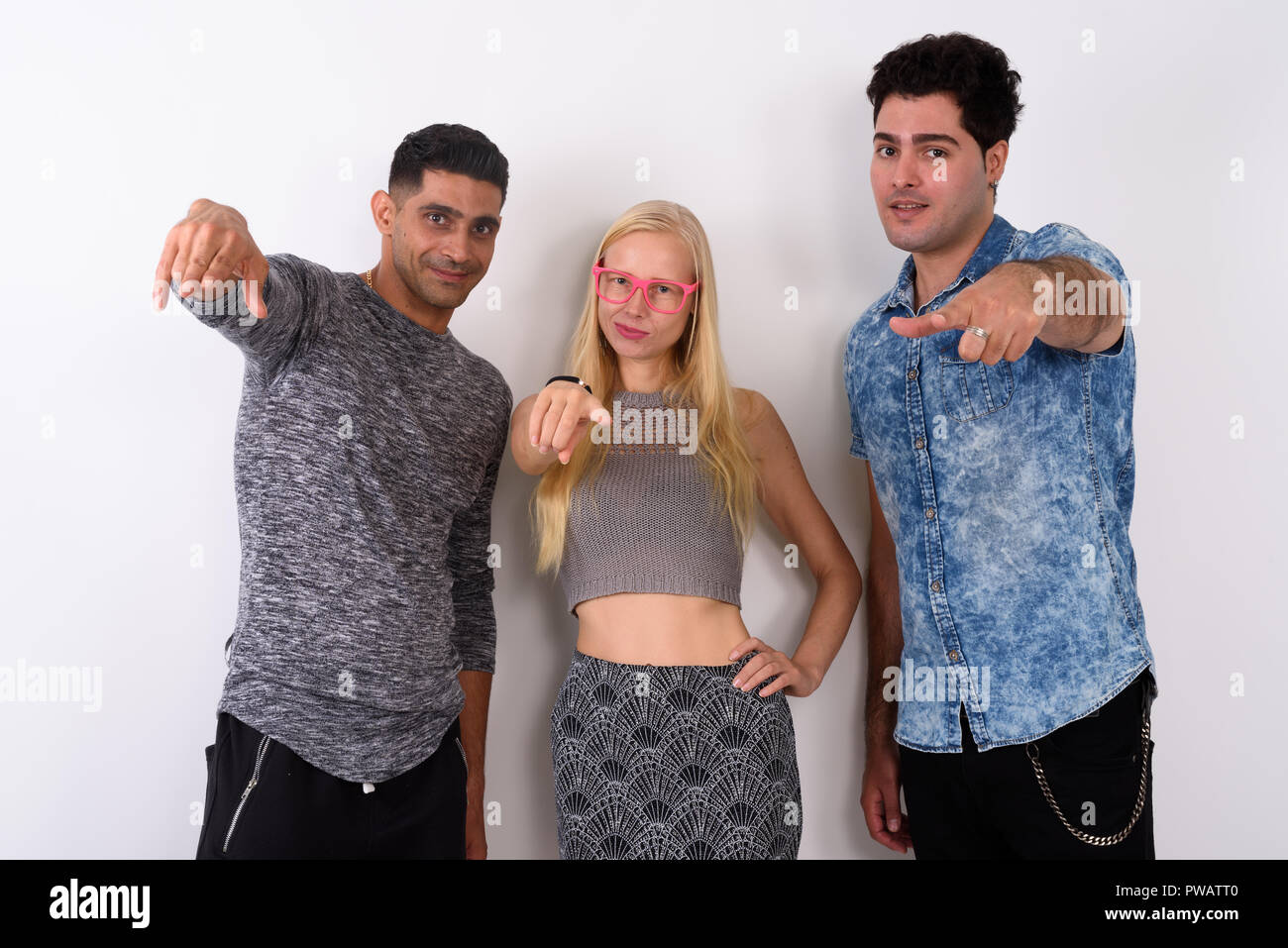 Three multi-ethnic friends together against white background Stock ...